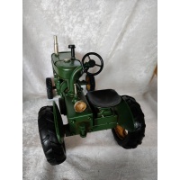 Blikken miniatuur groene tractor met gele wielen
